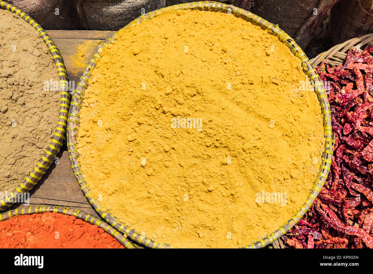 View of Turmeric powder on the trays in the market Stock Photo - Alamy