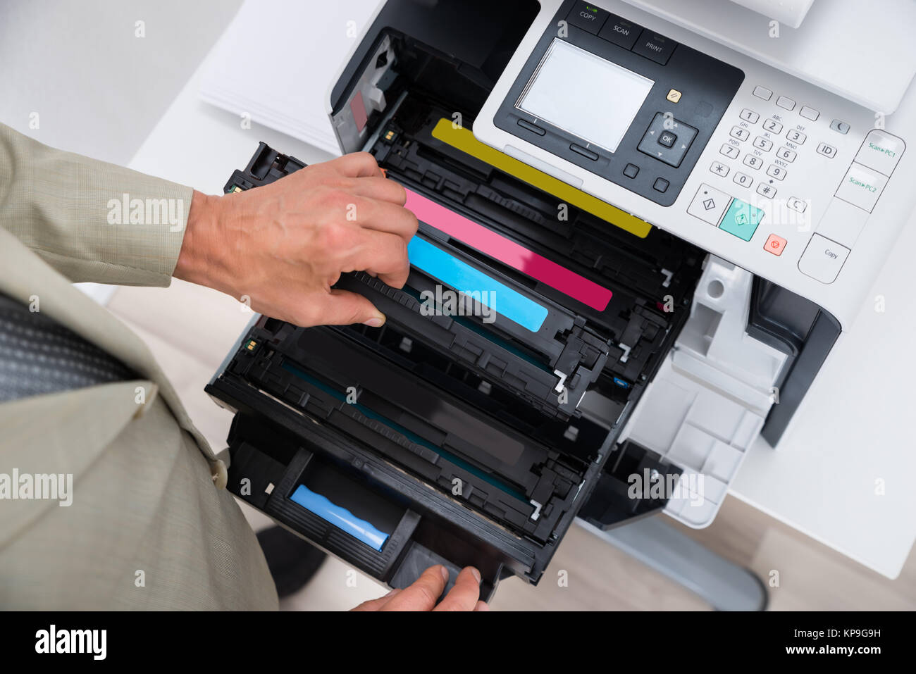 Businessman Fixing Cartridge In Photocopy Machine Stock Photo - Alamy