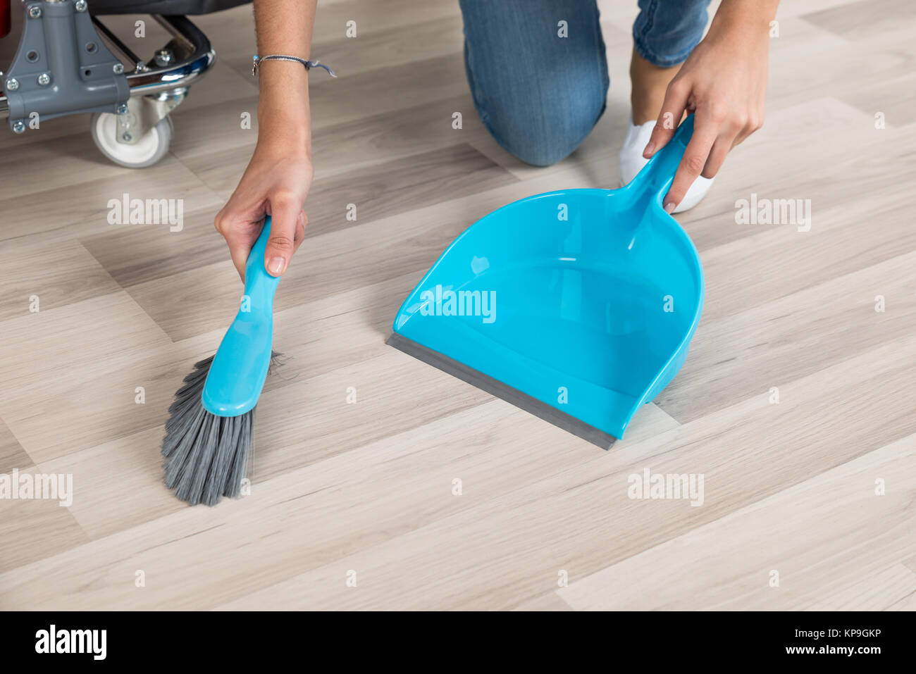 Cleaner Sweeping Floor With Broom And Dustpan In Office Stock Photo - Alamy