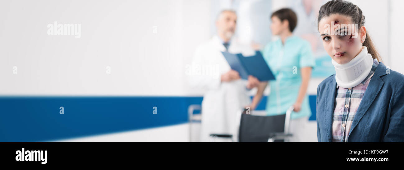 Young female patient with cervical collar support at the hospital and ...