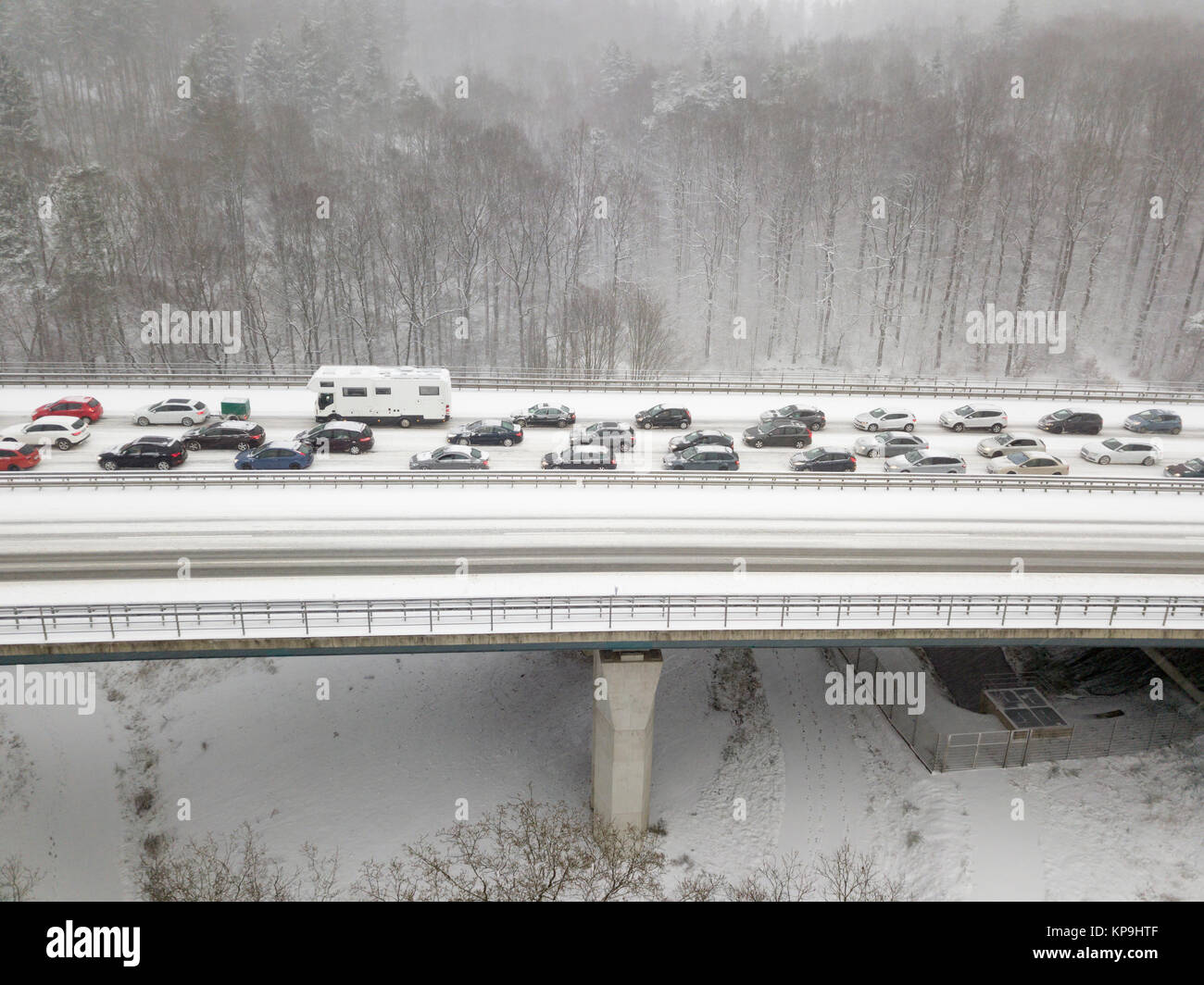 Cars on a highway bridge during a heavy snowfall in winter Stock Photo ...