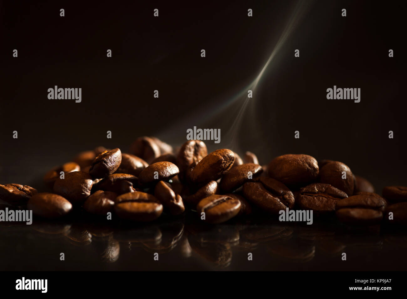 Roasted smoking coffee beans close hi-res stock photography and images ...