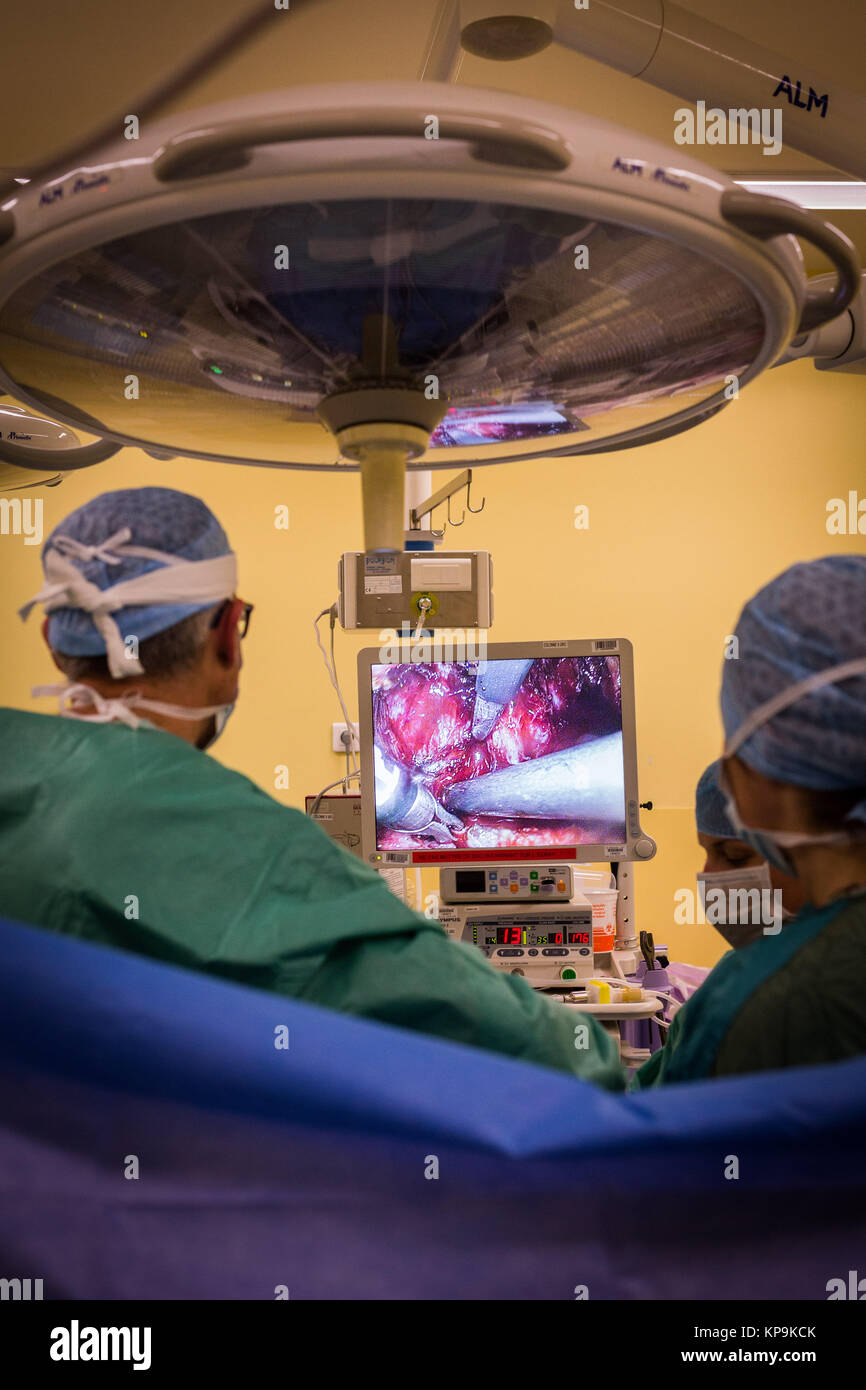 Surgical team performing prostatectomy (prostate ablation) under ...