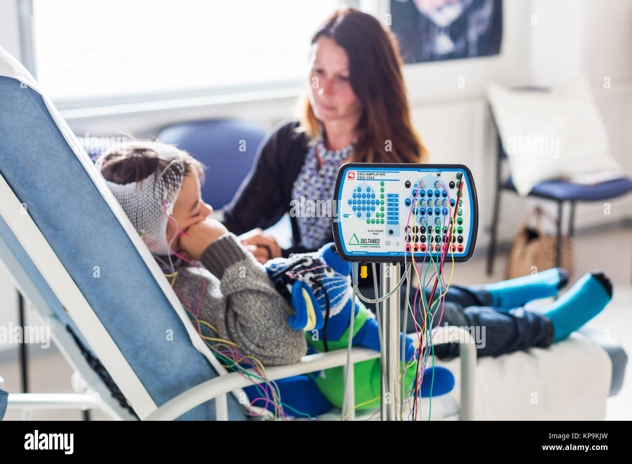 Child undergoing an electroencephalogram (EEG), epilepsy screening ...