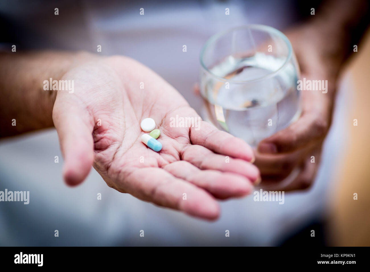 Woman taking medication Stock Photo - Alamy
