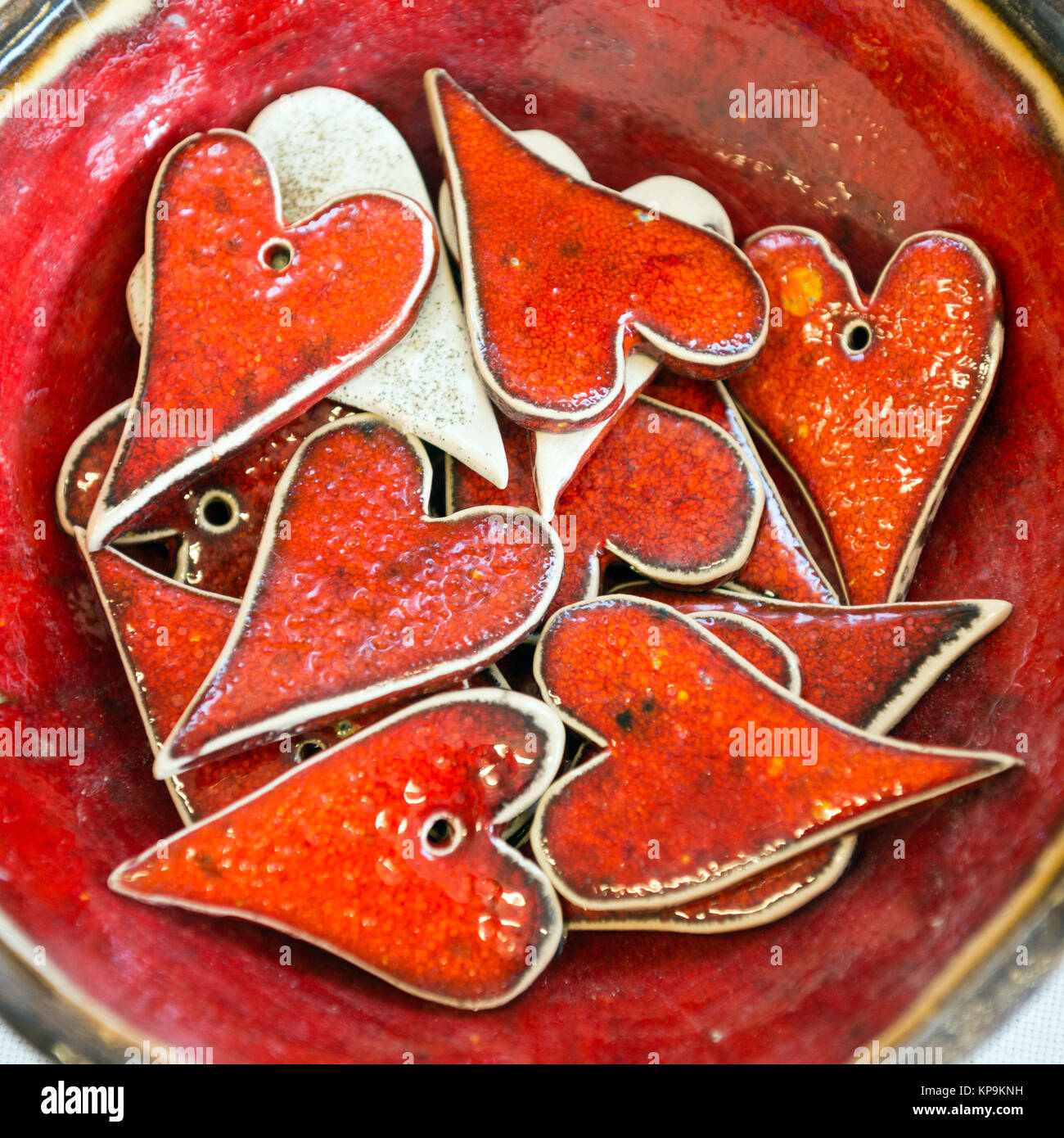 Red ceramic hearts in a bow Stock Photo - Alamy
