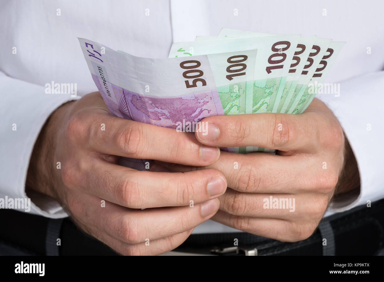 Businessman Counting Euro Banknotes Stock Photo - Alamy