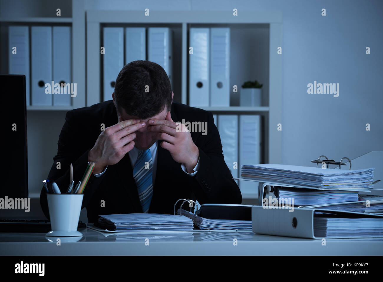 Stressed Accountant Working Late In Office Stock Photo - Alamy