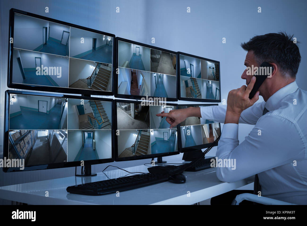 Security System Operator Looking At CCTV Footage Stock Photo - Alamy