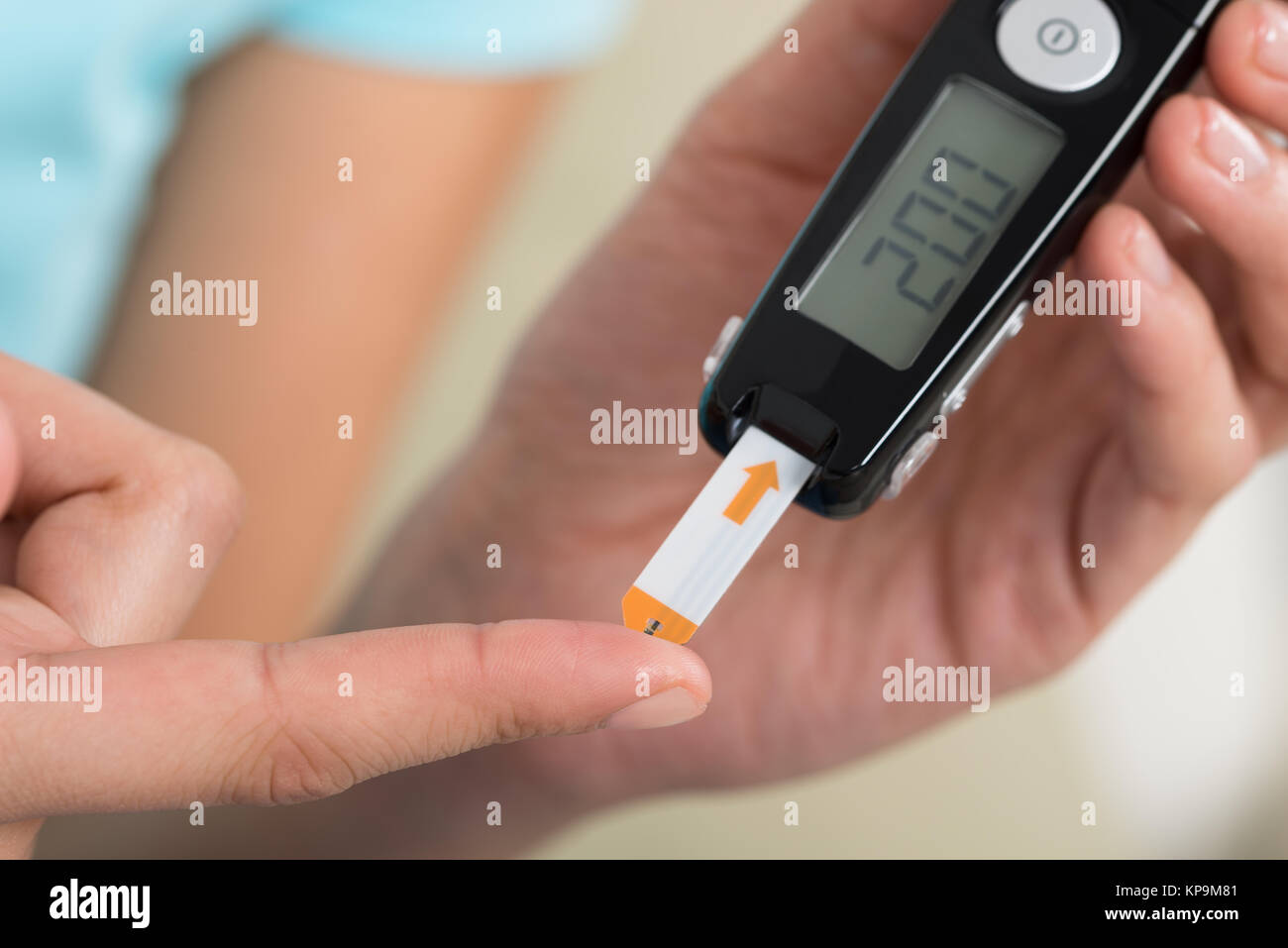 Woman Checking Blood Sugar Level Stock Photo - Alamy