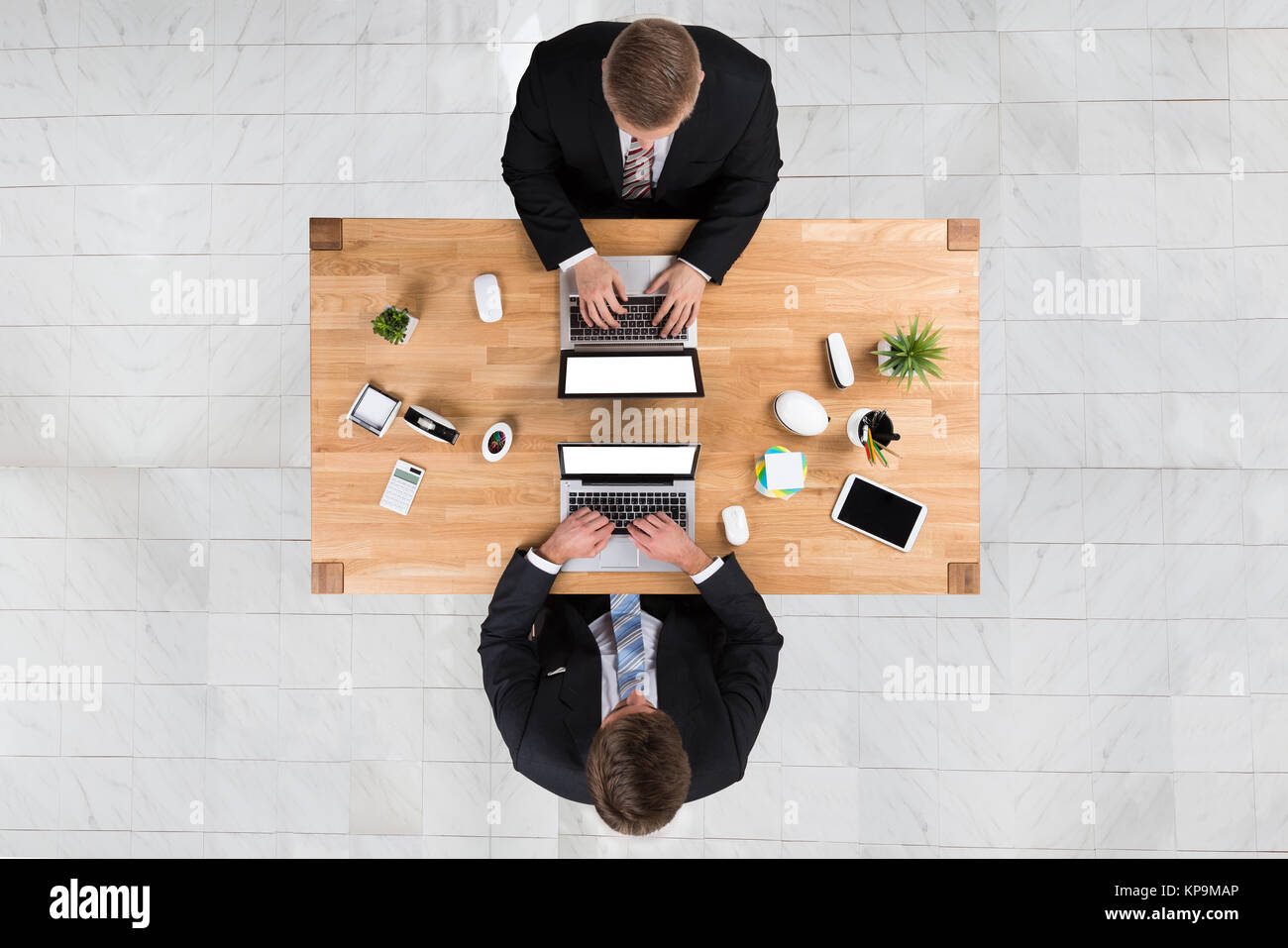Professional businessmen using laptops hi-res stock photography and ...