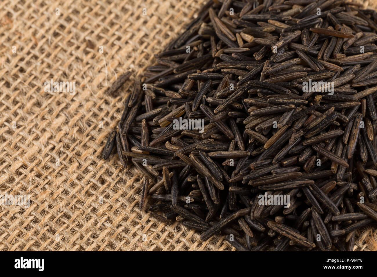 Heap of wild rice on white background Stock Photo - Alamy