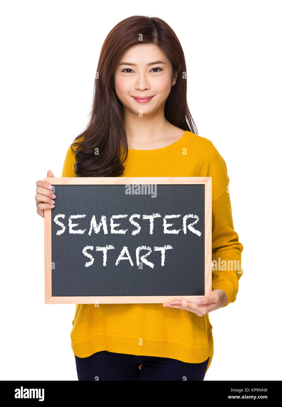 Woman with chalkboard showing phrase of semester start Stock Photo - Alamy