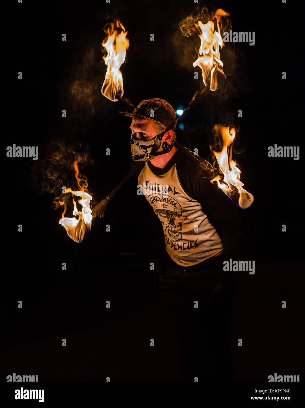 Mikey Adamski performing for a group of photographers in an industrial ...