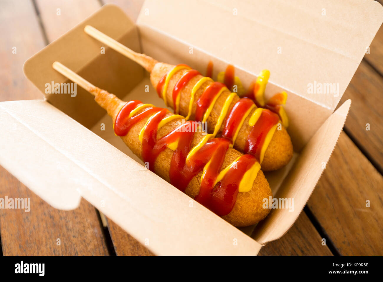 Corn dog in paper box Stock Photo - Alamy