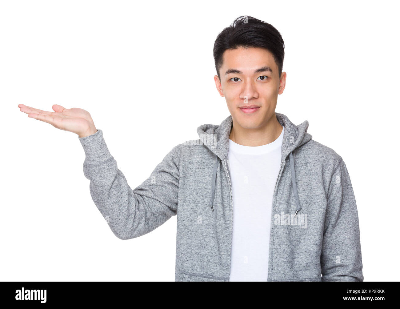 Asian young man with open hand palm Stock Photo - Alamy