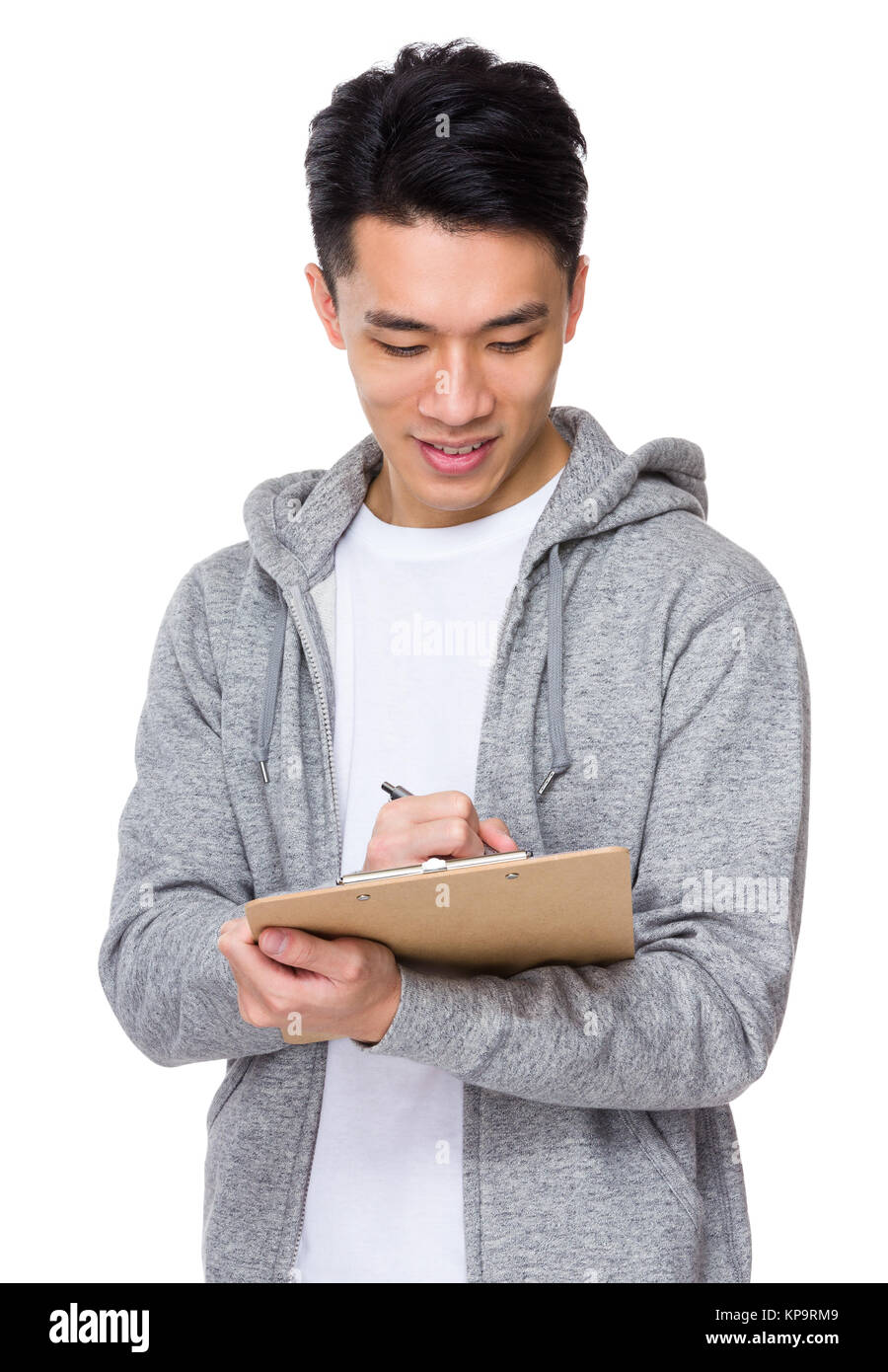 Asian man write on clipboard Stock Photo - Alamy