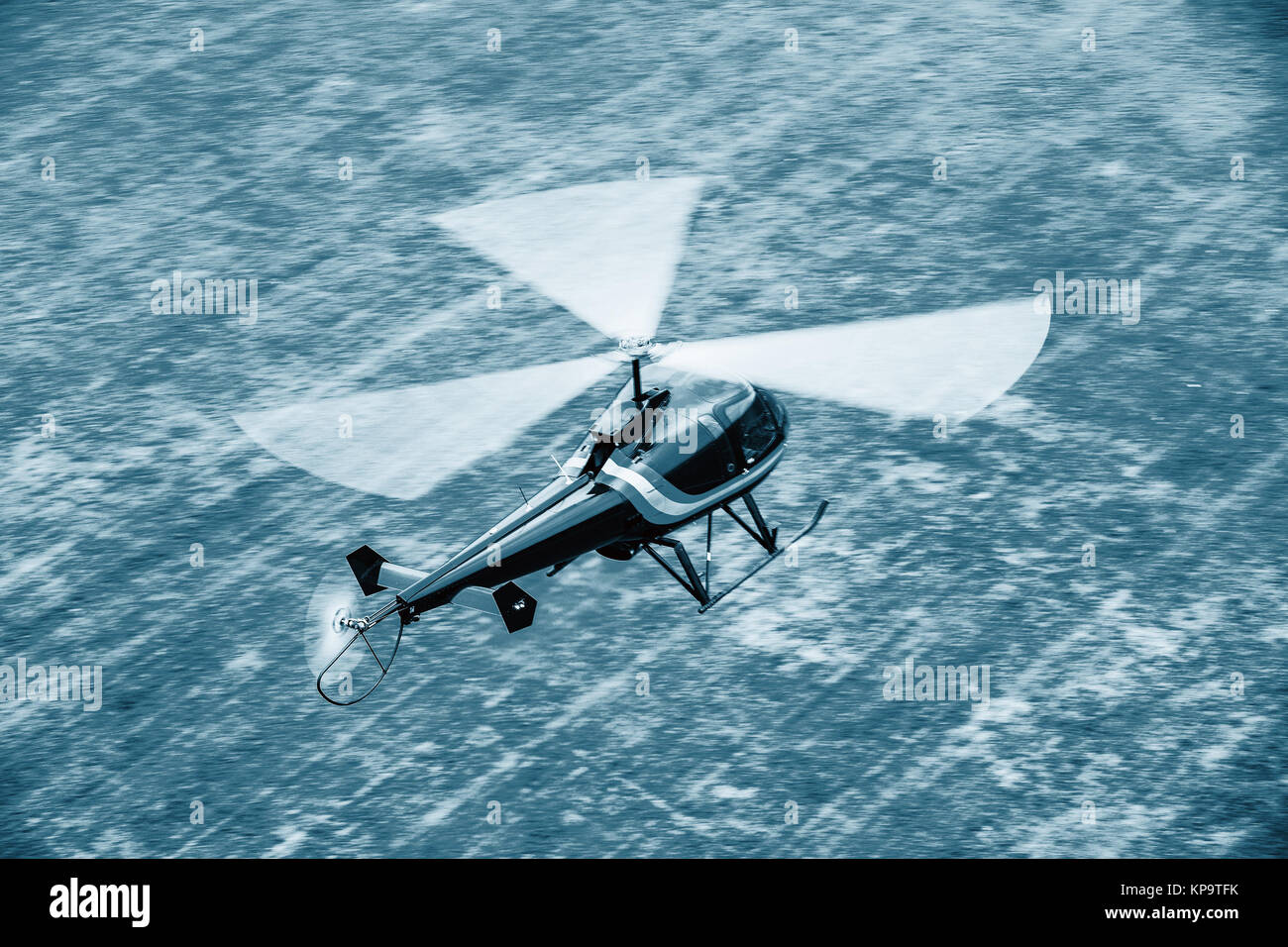 Black helicopter flying in front. Light multipurpose helicopter five ...