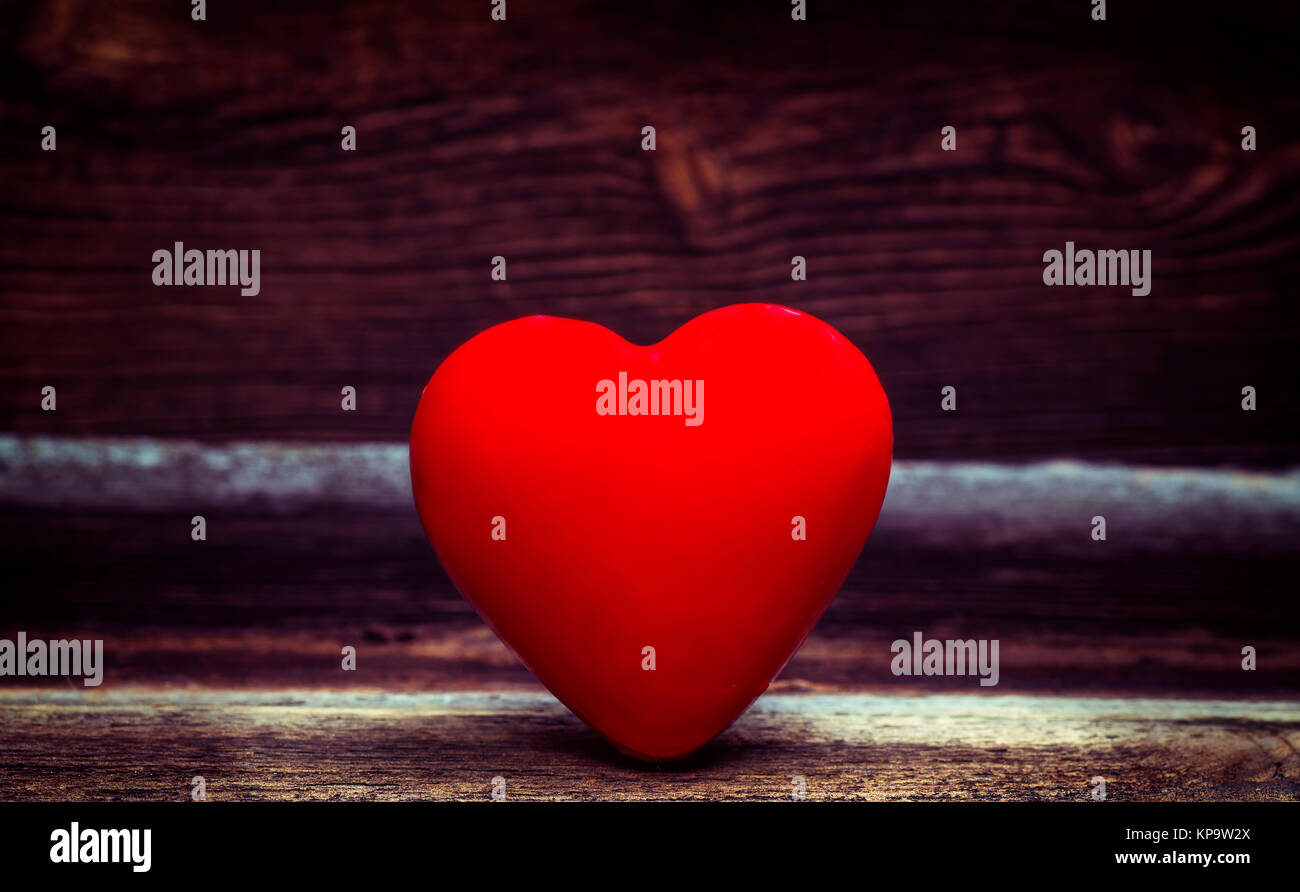 Red Wax Heart On Old Board Stock Photo - Alamy