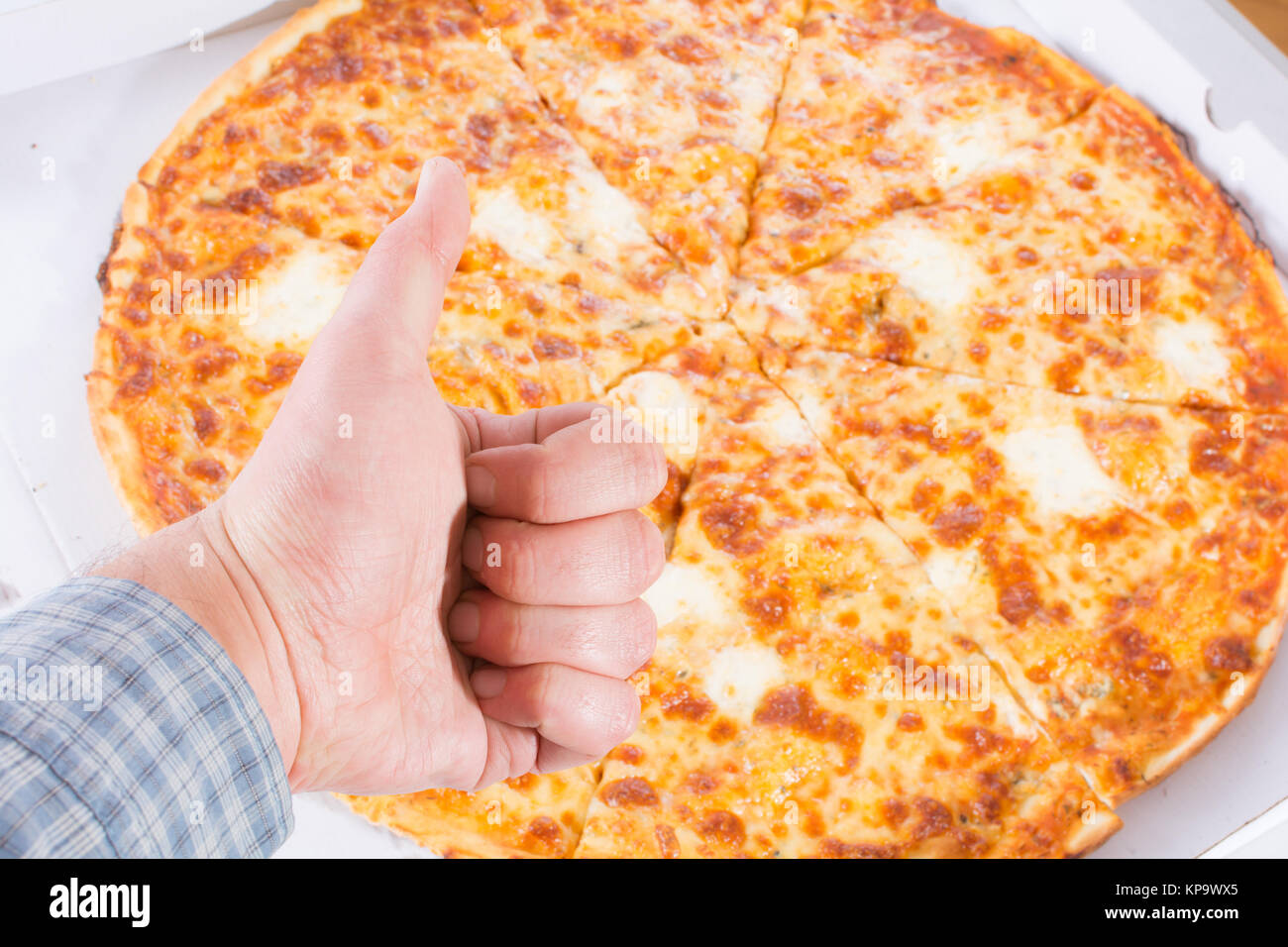 Delicious pizza with thumb up on the background of box Stock Photo - Alamy