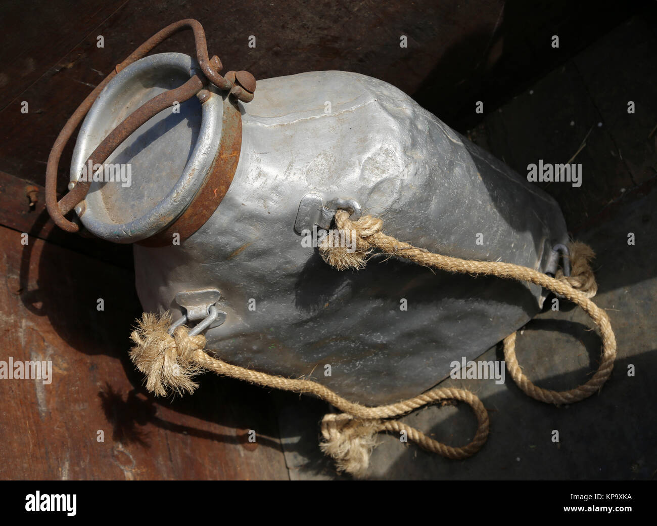 old aluminum milk churn used by the milkman to transport milk from the ...