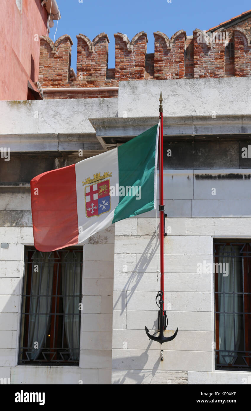 Italian flag with the symbols of the Italian maritime republics waving ...