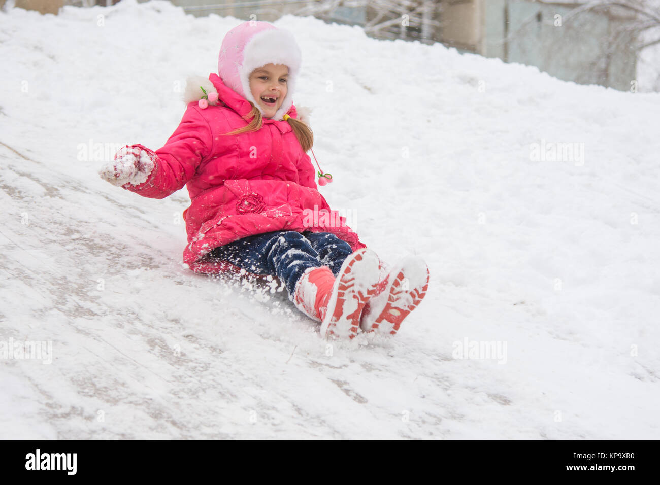 Girl going down slide hi-res stock photography and images - Alamy