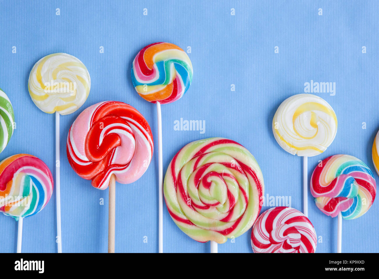 colorful lollipops on blue Stock Photo - Alamy