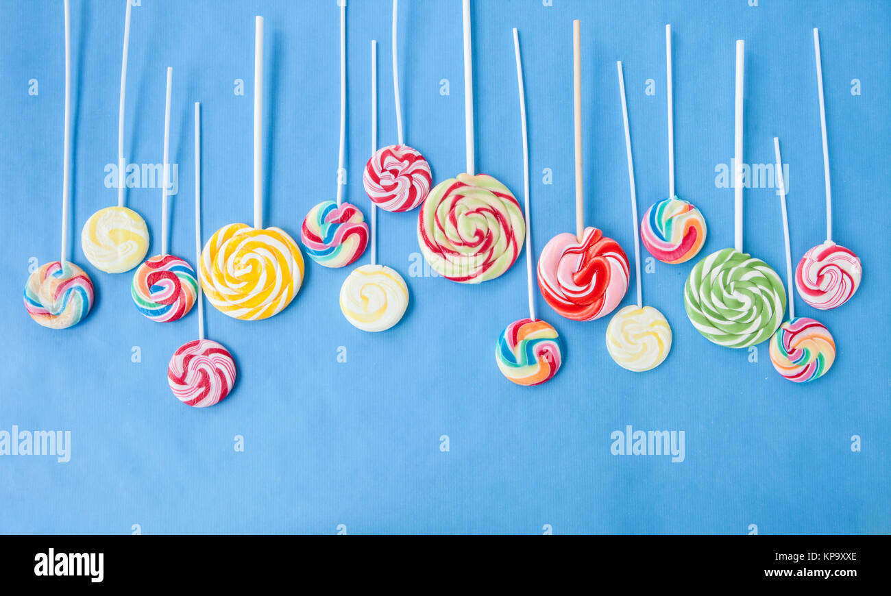 colorful lollipops on blue Stock Photo - Alamy