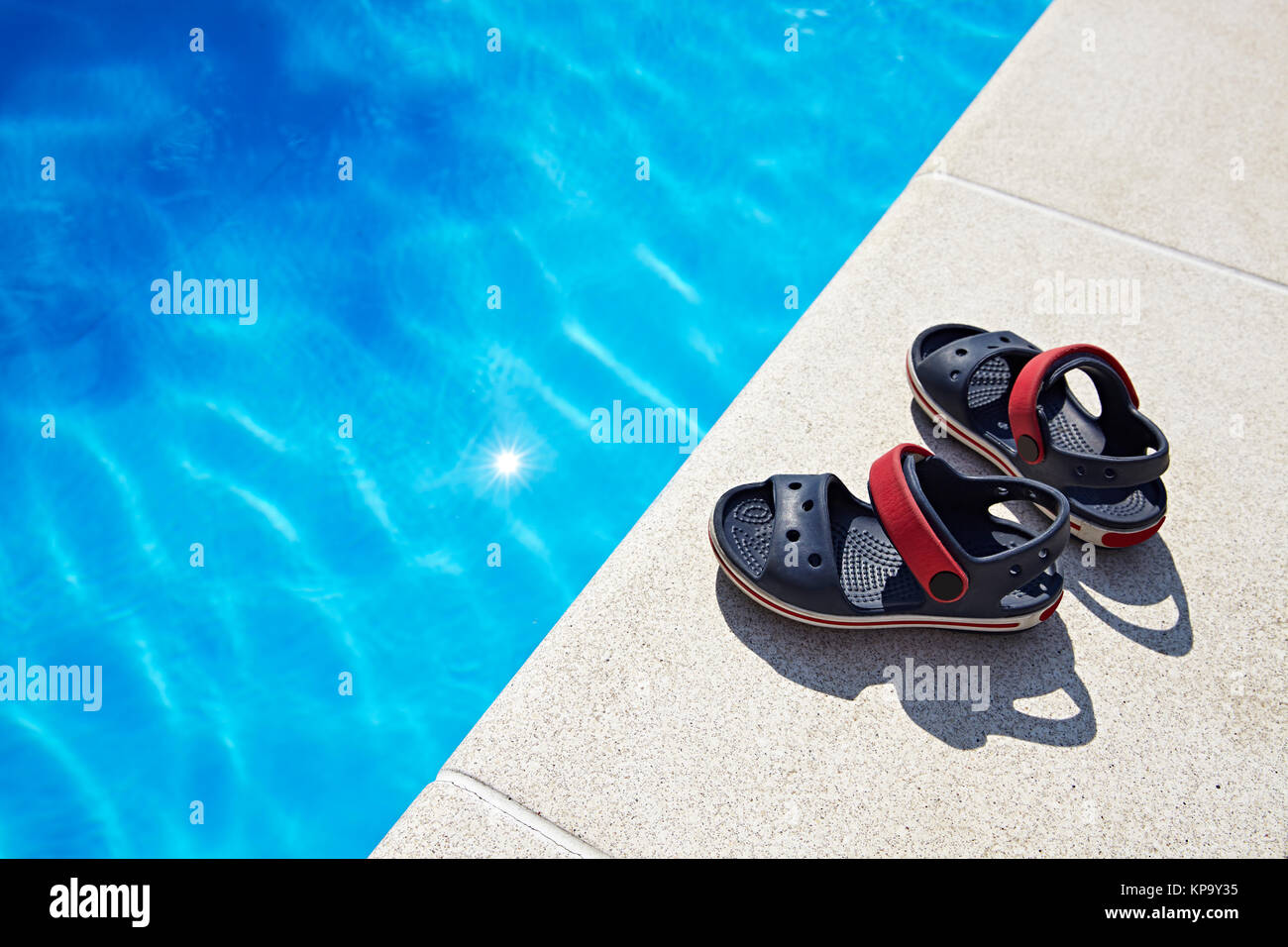 Baby sandals at the swimming pool Stock Photo - Alamy