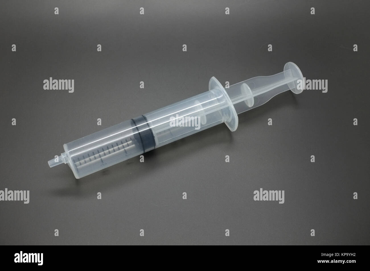 Syring isolated on gray background Stock Photo - Alamy