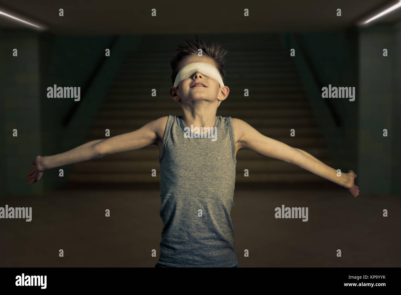 Young Boy with Eyes Covered Opening his Arms Wide Stock Photo - Alamy