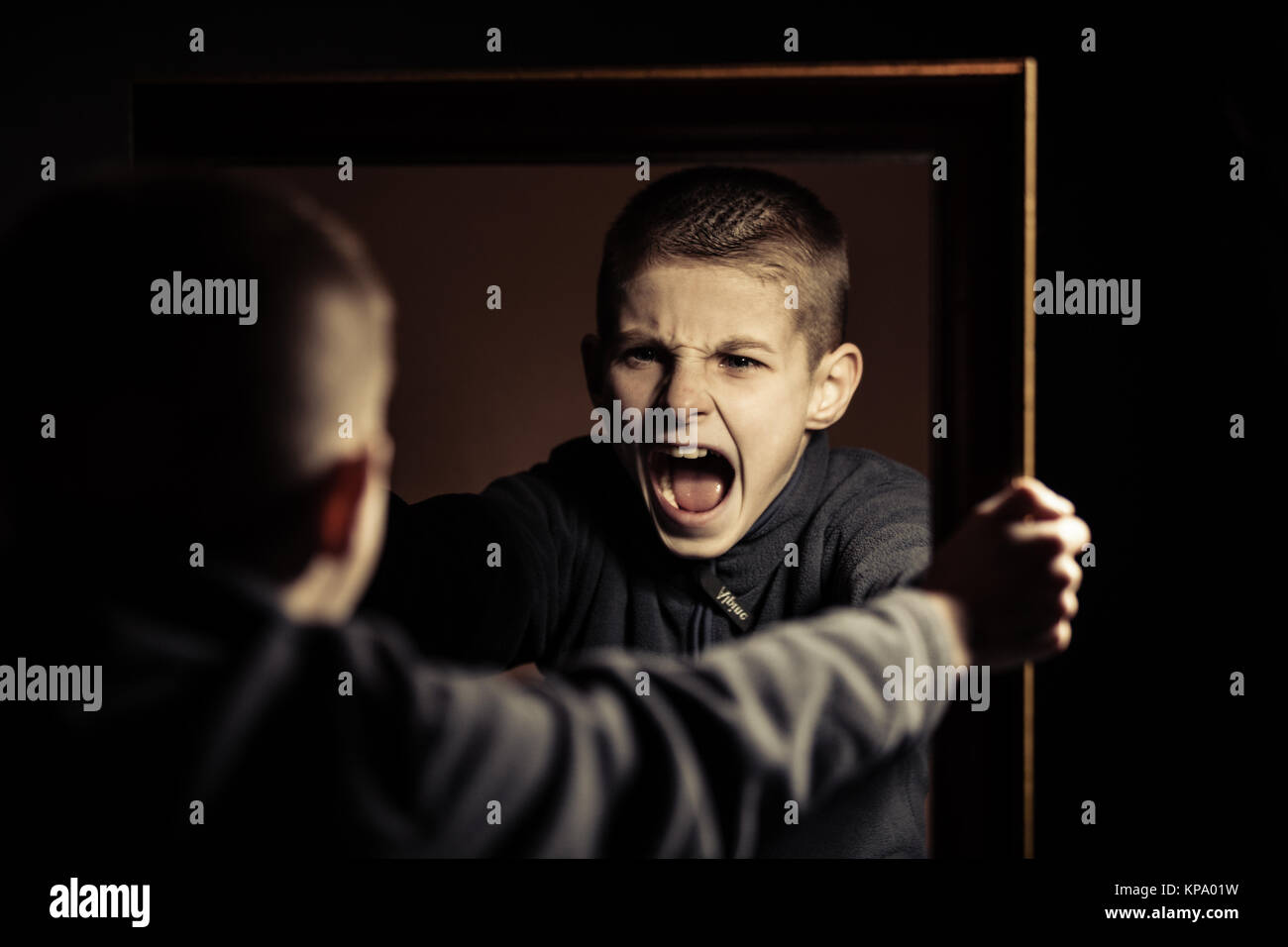 Angry Boy Shouting on his Own Mirror Reflection Stock Photo - Alamy