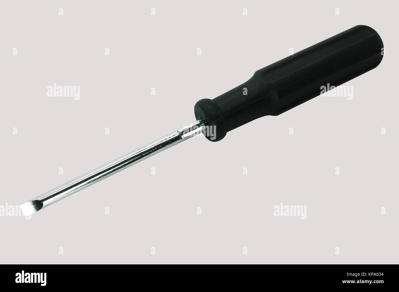 Black screwdriver isolated on gray background Stock Photo - Alamy