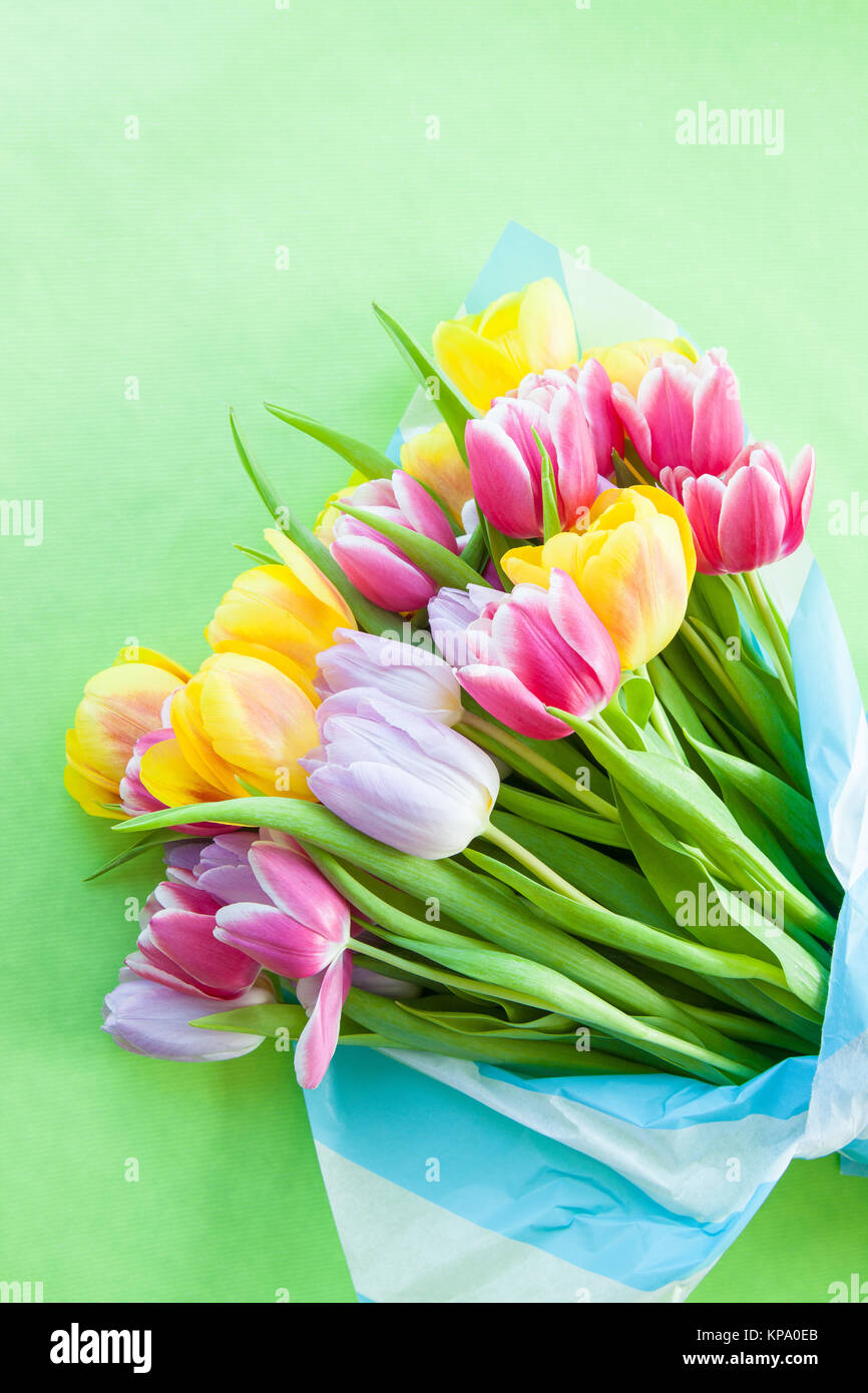 Easter background with a tulip bouquet on green Stock Photo - Alamy