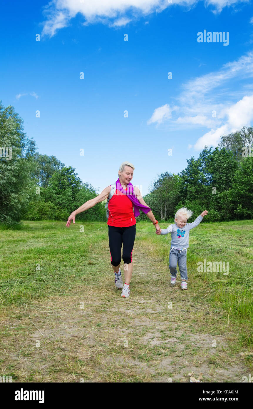 A woman with a child on the sports outing Stock Photo - Alamy