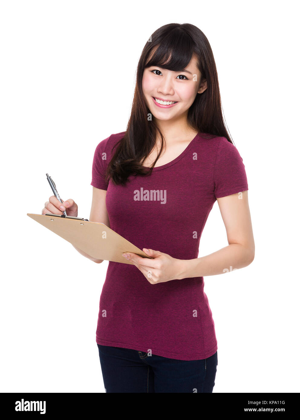 Young Woman take note on clipboard Stock Photo - Alamy
