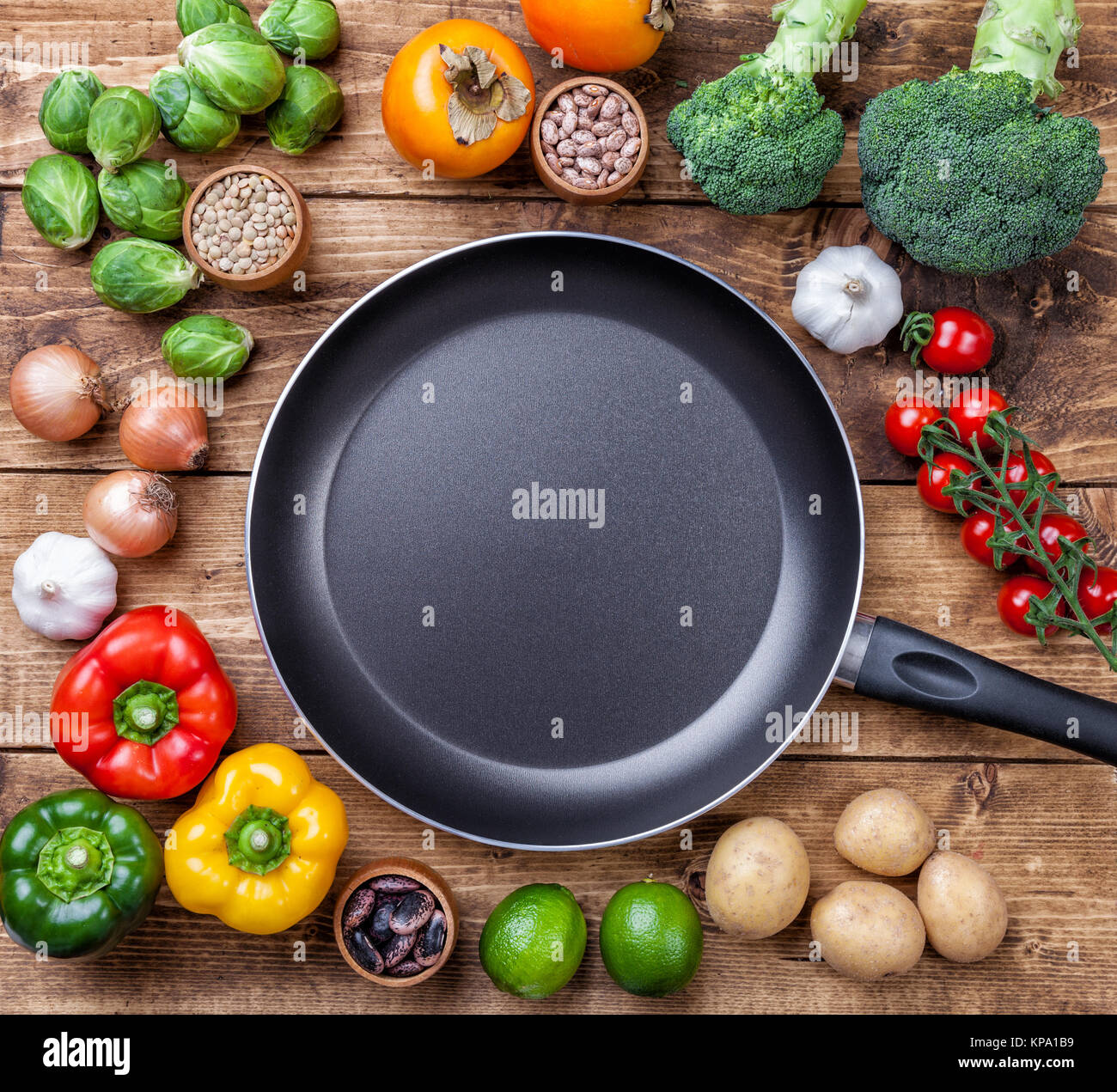 Various vegetables fruits and herbs with a frying pan Stock Photo - Alamy