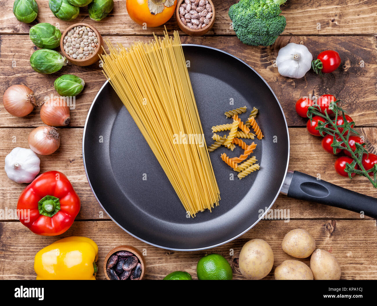 Various vegetables fruits and herbs with a frying pan Stock Photo - Alamy