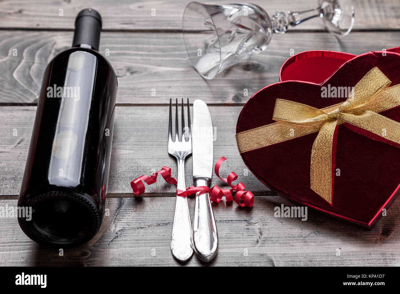 Romantic dinner set on wooden background Stock Photo - Alamy