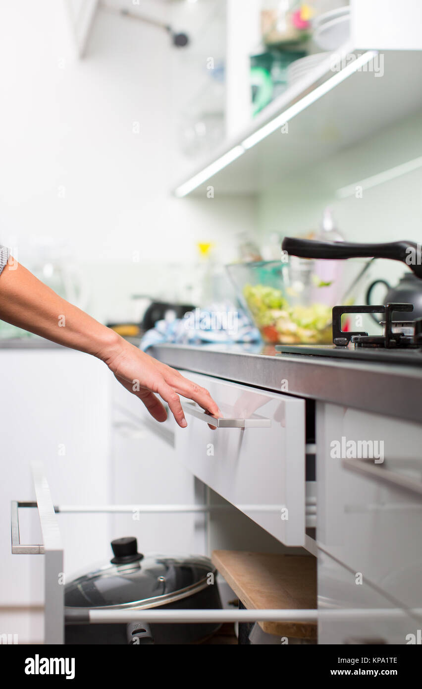 Young woman washing dishes in her modern kitchen Stock Photo - Alamy