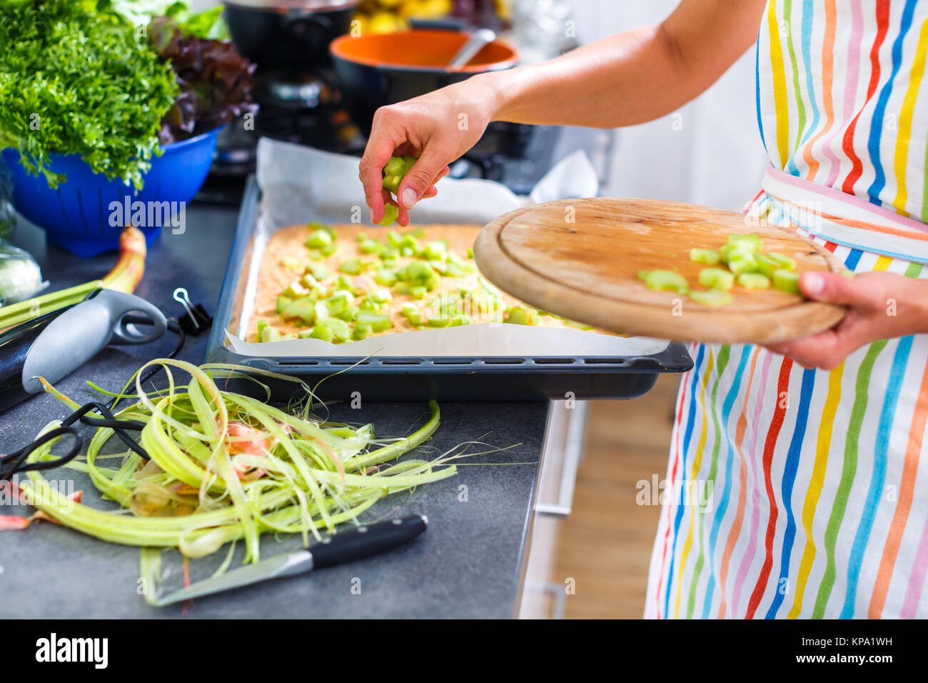 Young woman cooking in her modern kitchen Stock Photo - Alamy