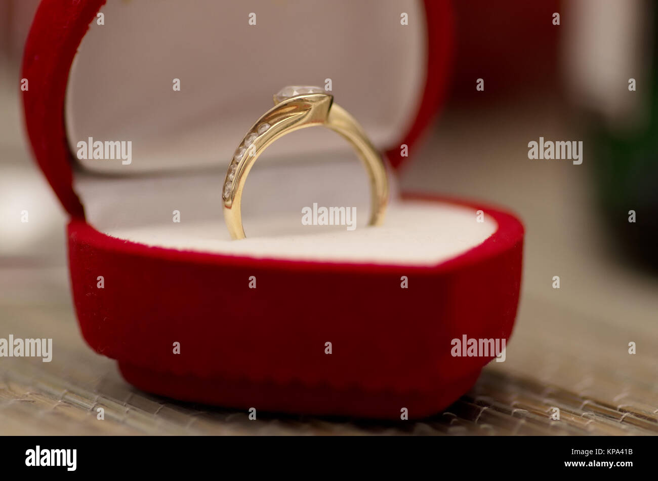 An engagement ring in a red box Stock Photo - Alamy