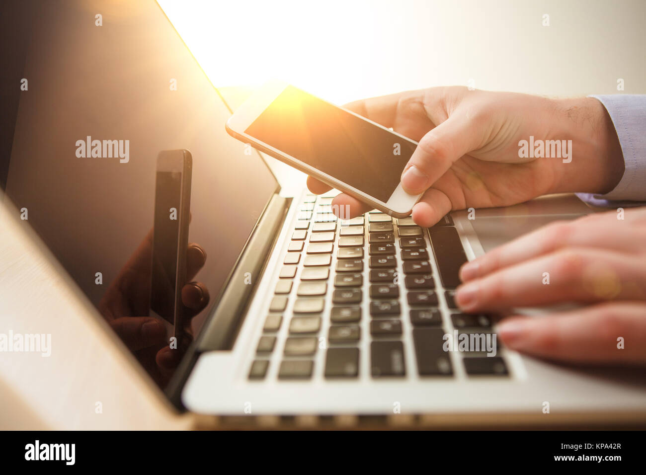 The male hand holding a phone Stock Photo - Alamy