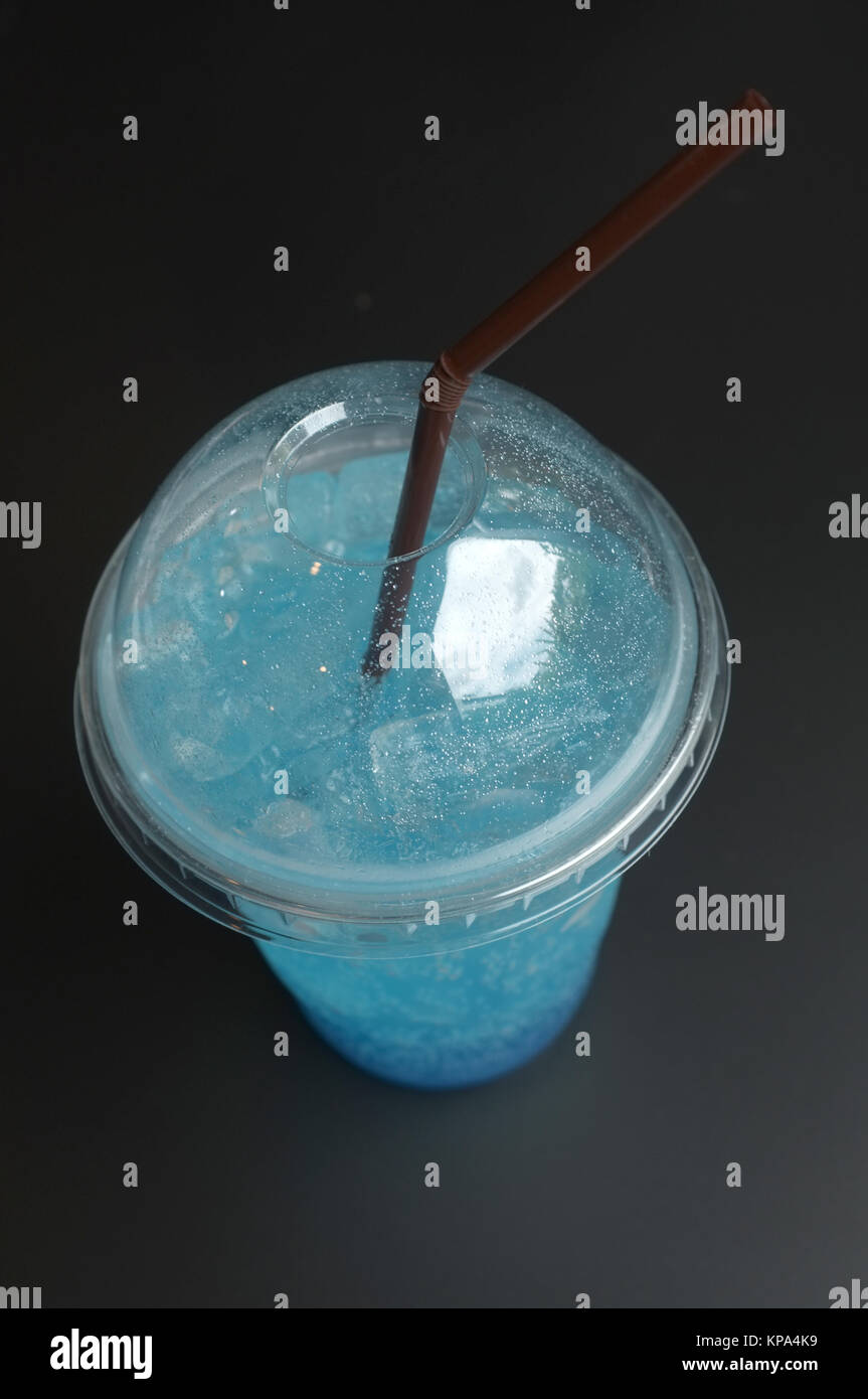 Blue cocktail in a plastic cup Stock Photo - Alamy