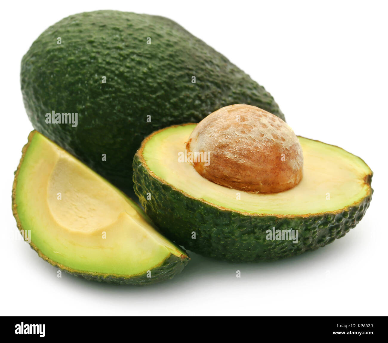 Fresh avocado whole and sliced with seed Stock Photo - Alamy