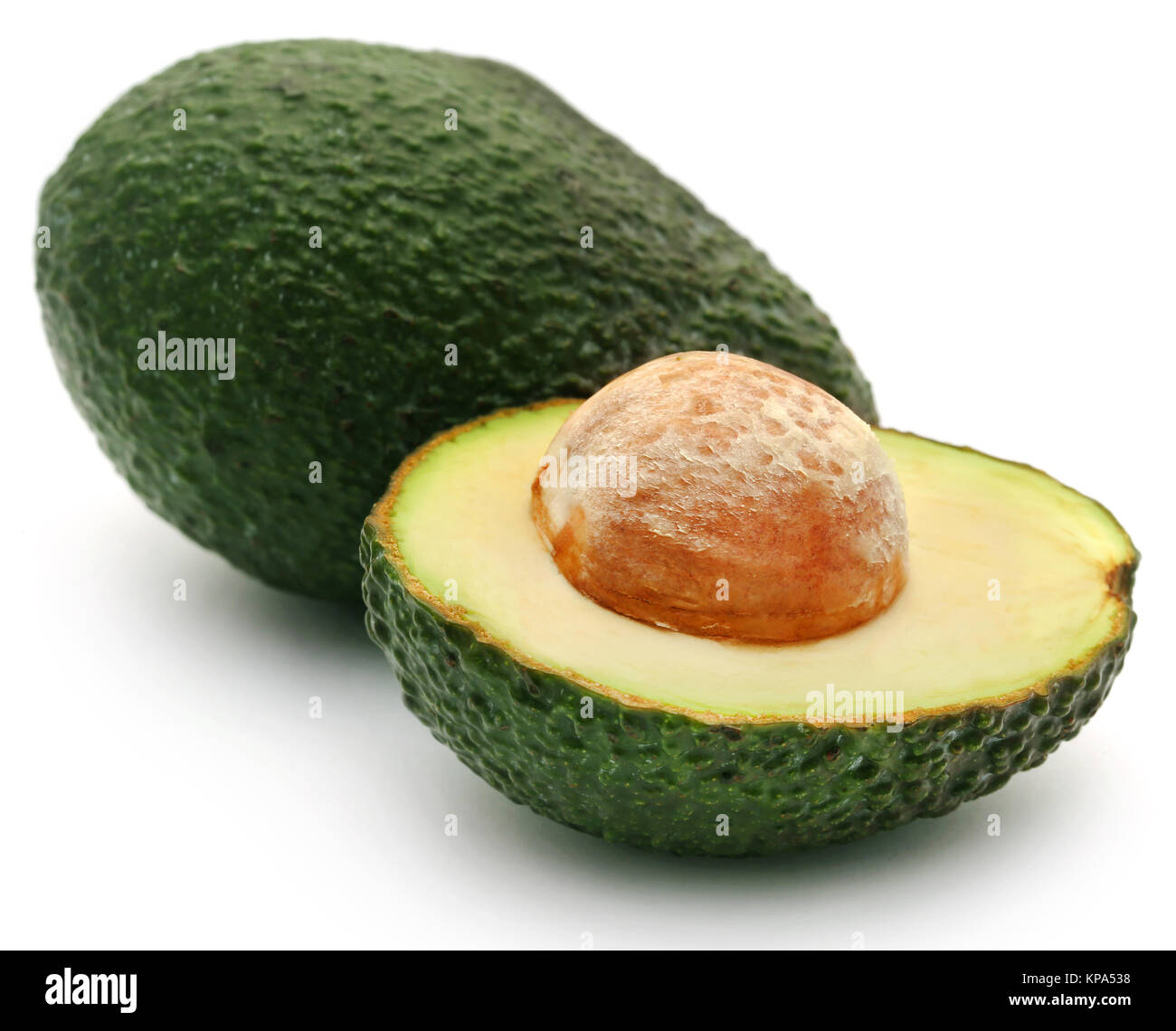 Fresh avocado whole and sliced with seed Stock Photo - Alamy