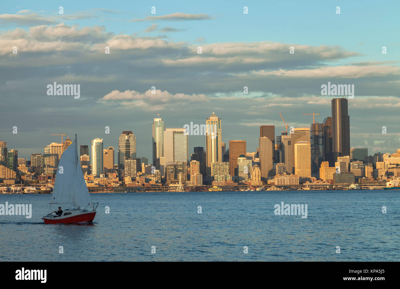 Man on the sailboat, with the city of Seattle, Washington, United ...