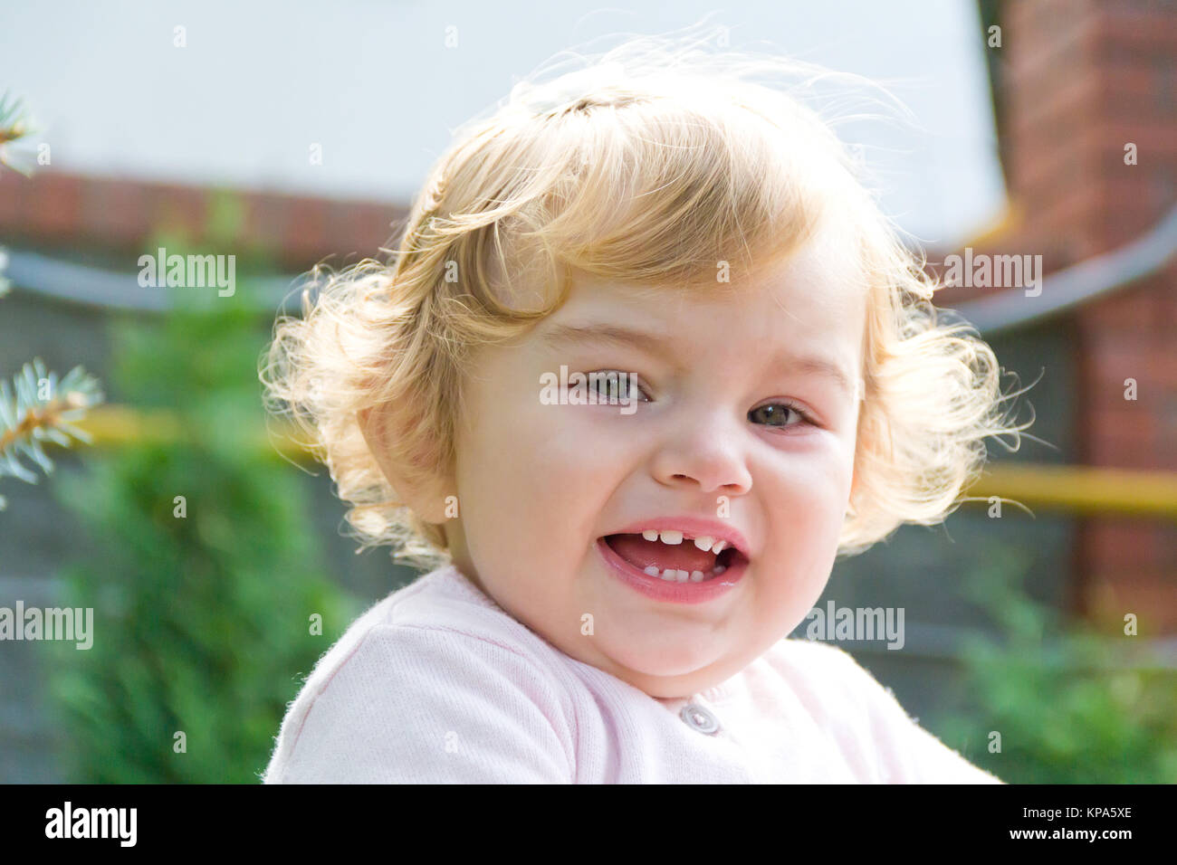 Cute crying infant Stock Photo - Alamy