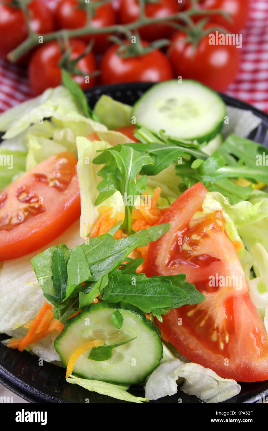 mixed salad from pizza service Stock Photo - Alamy